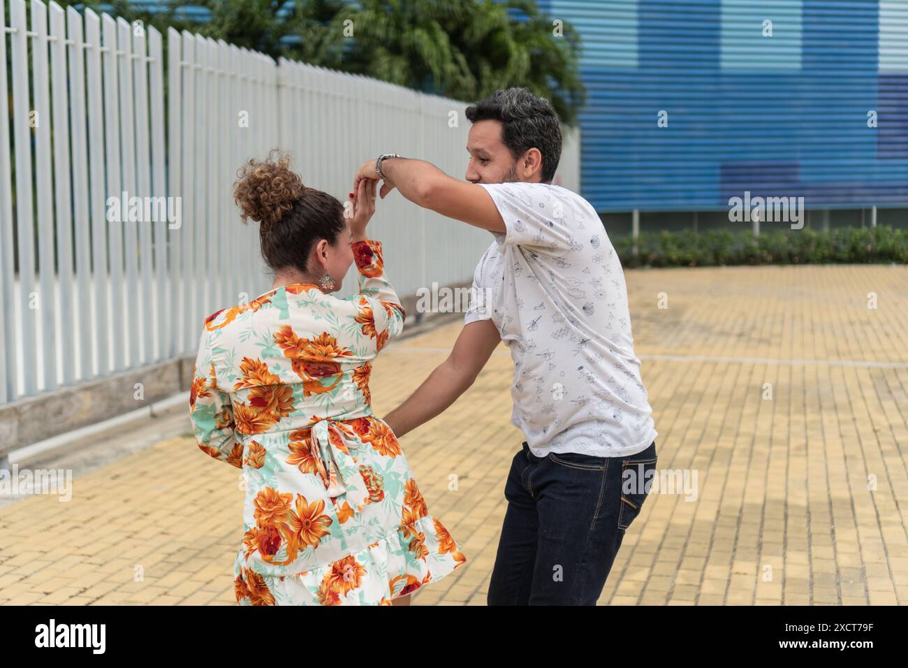 Couple Dancing Joyfully in Outdoor Urban Space Stock Photo - Alamy