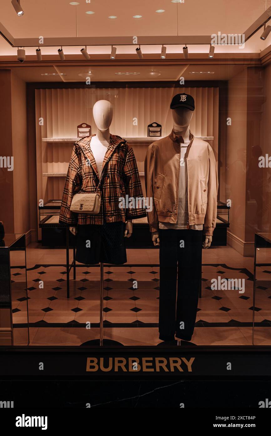 Showcase with mannequins in a luxury famous Burberry boutique. Burberry ...