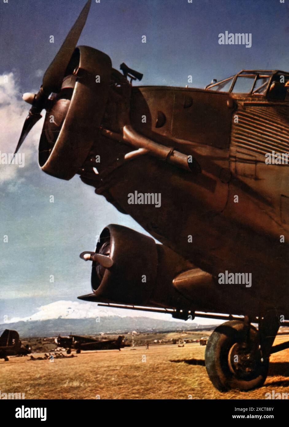 A photograph shows a Junkers Ju 52 aircraft in Sicily during the Second ...