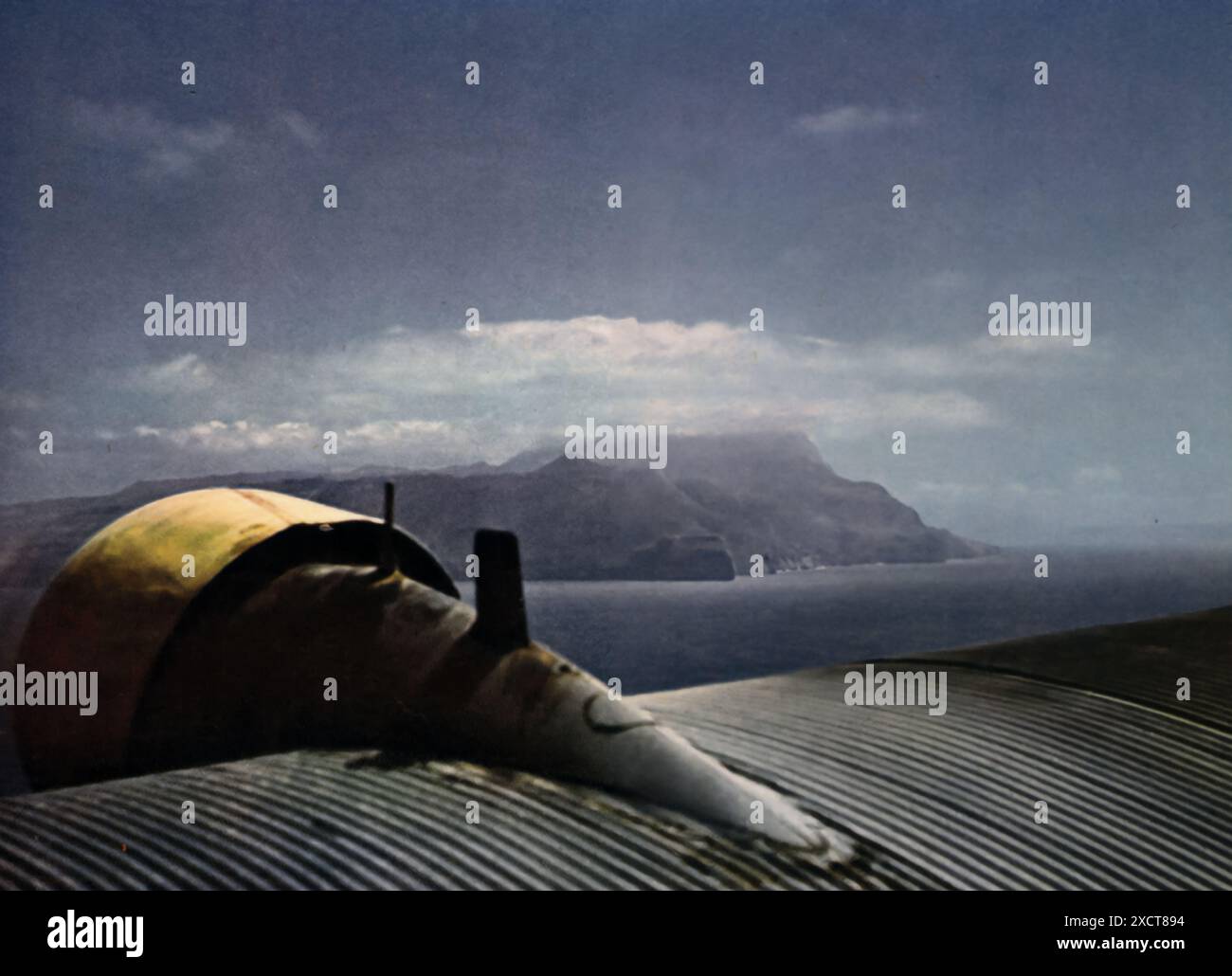 A photograph shows a German Ju 52 aircraft from the Luftwaffe flying ...