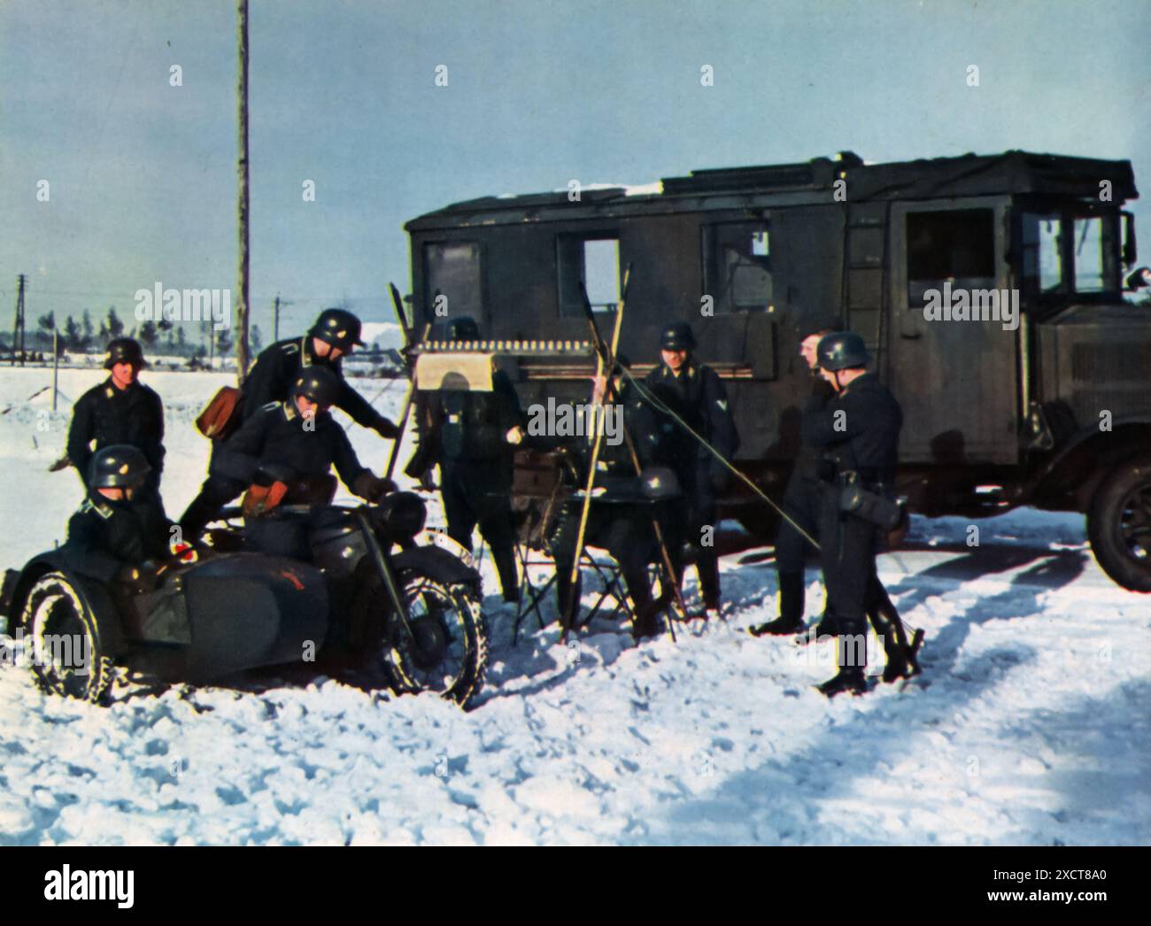 A photograph shows Luftwaffe signal troops transmitting an order during ...