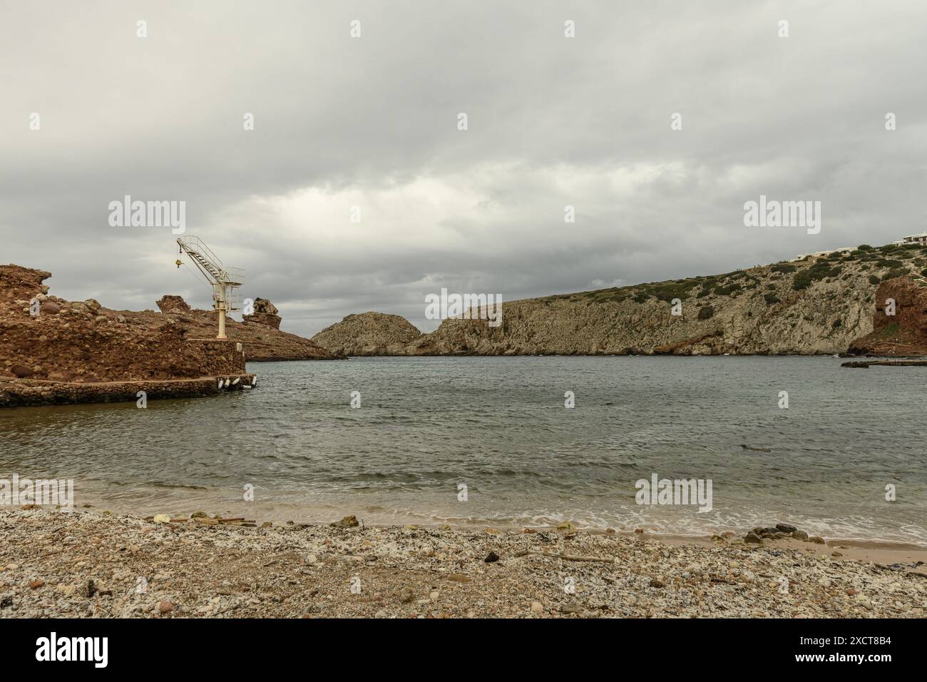 The distinctive rocky formations of Cala Morell, Menorca, under an ...