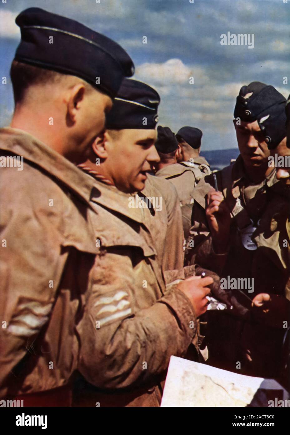 A photograph shows the commander and his crew from the German Air Force ...