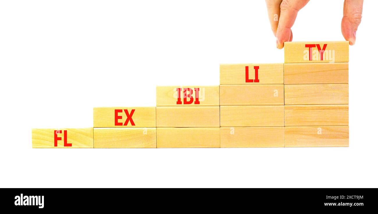 Flexibility symbol. Concept word Flexibility on beautiful wooden blocks. Businessman hand ...