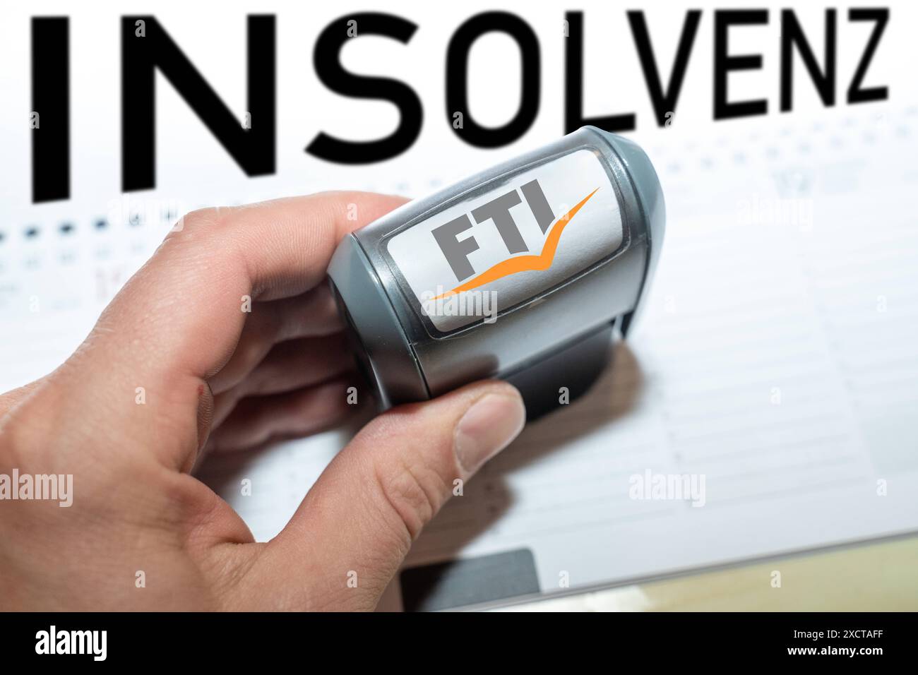 Bavaria, Germany - June 18, 2024: Hand holding stamp with the logo of ...