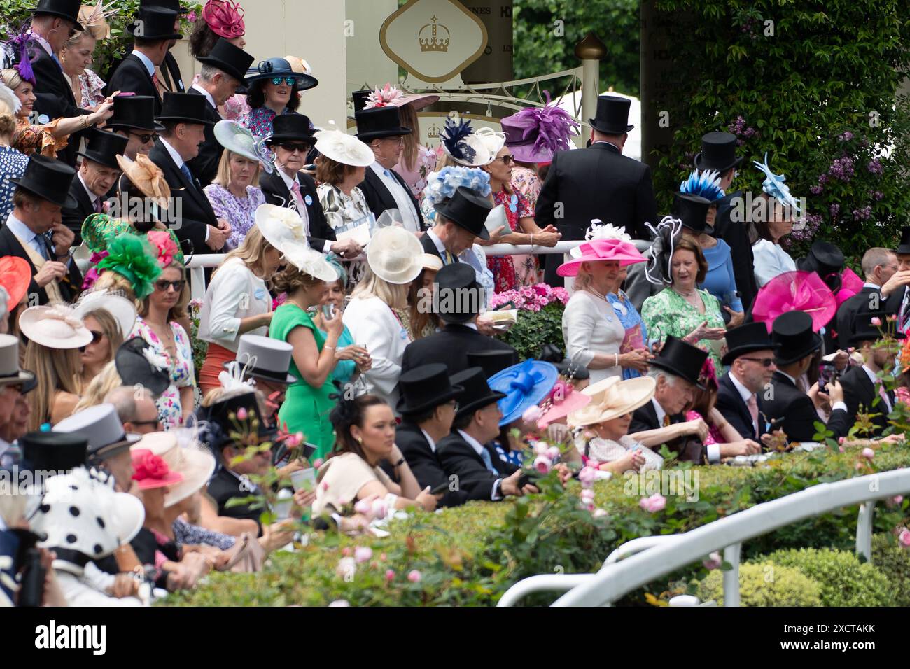 Racegoers in the Parade Ring waiting fo for the Royal Procession on day ...