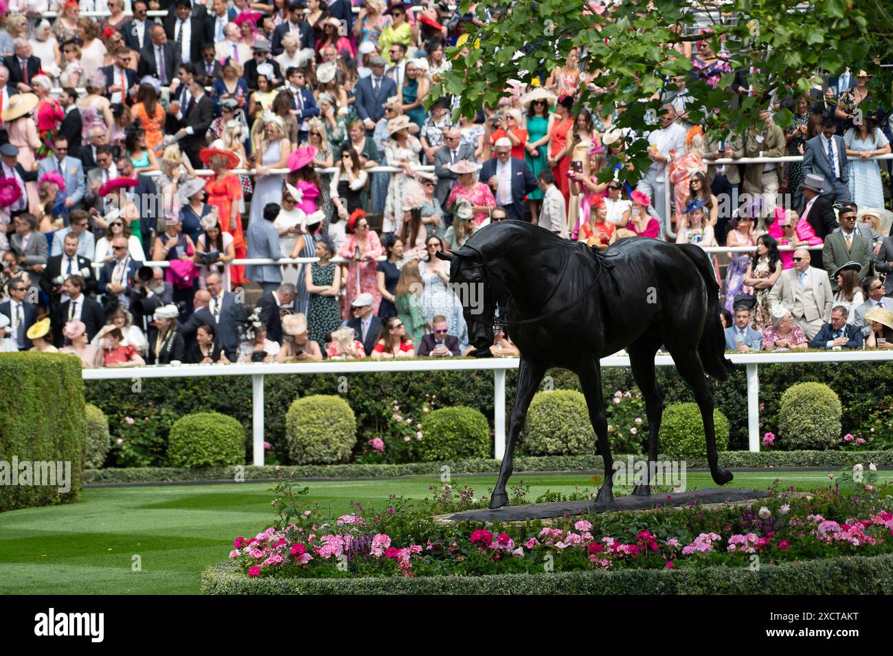 Racegoers in the Parade Ring waiting fo for the Royal Procession on day ...