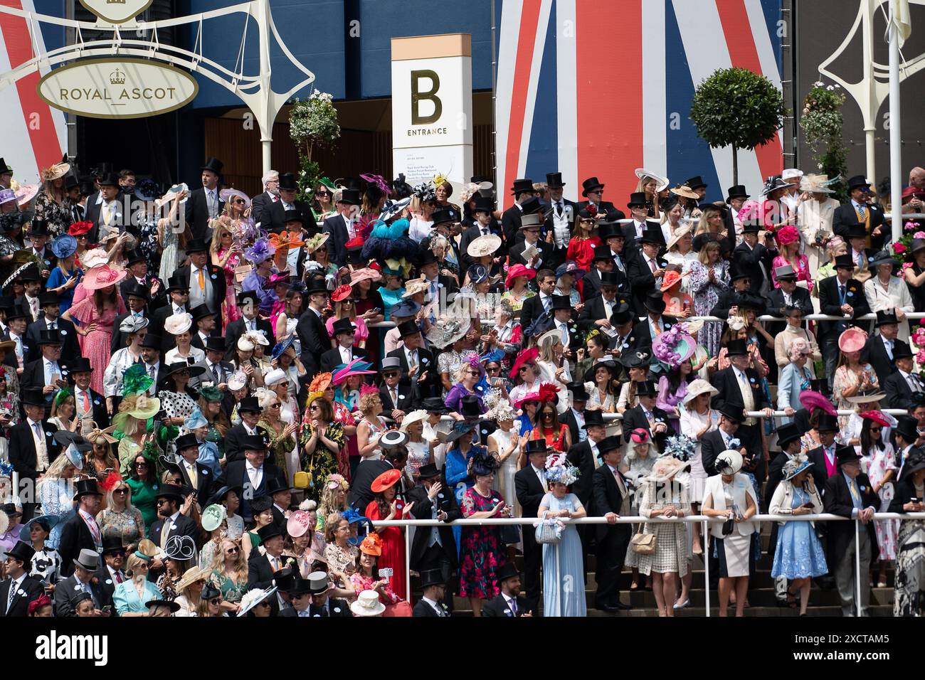 Racegoers in the Parade Ring waiting fo for the Royal Procession on day ...