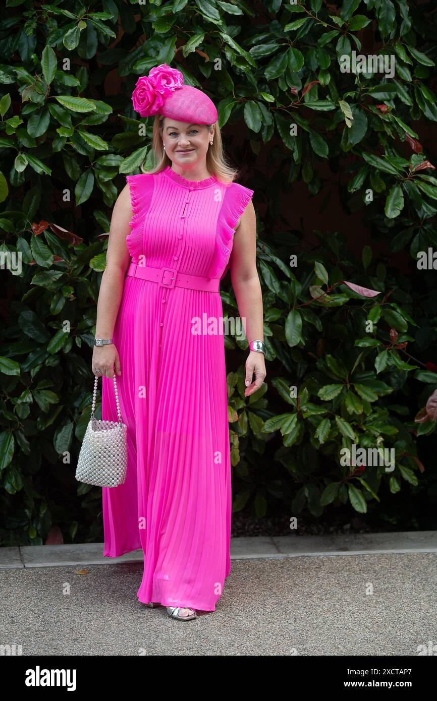 A lady wears a vibrant pink outfit to Day One of Royal Ascot at Ascot ...