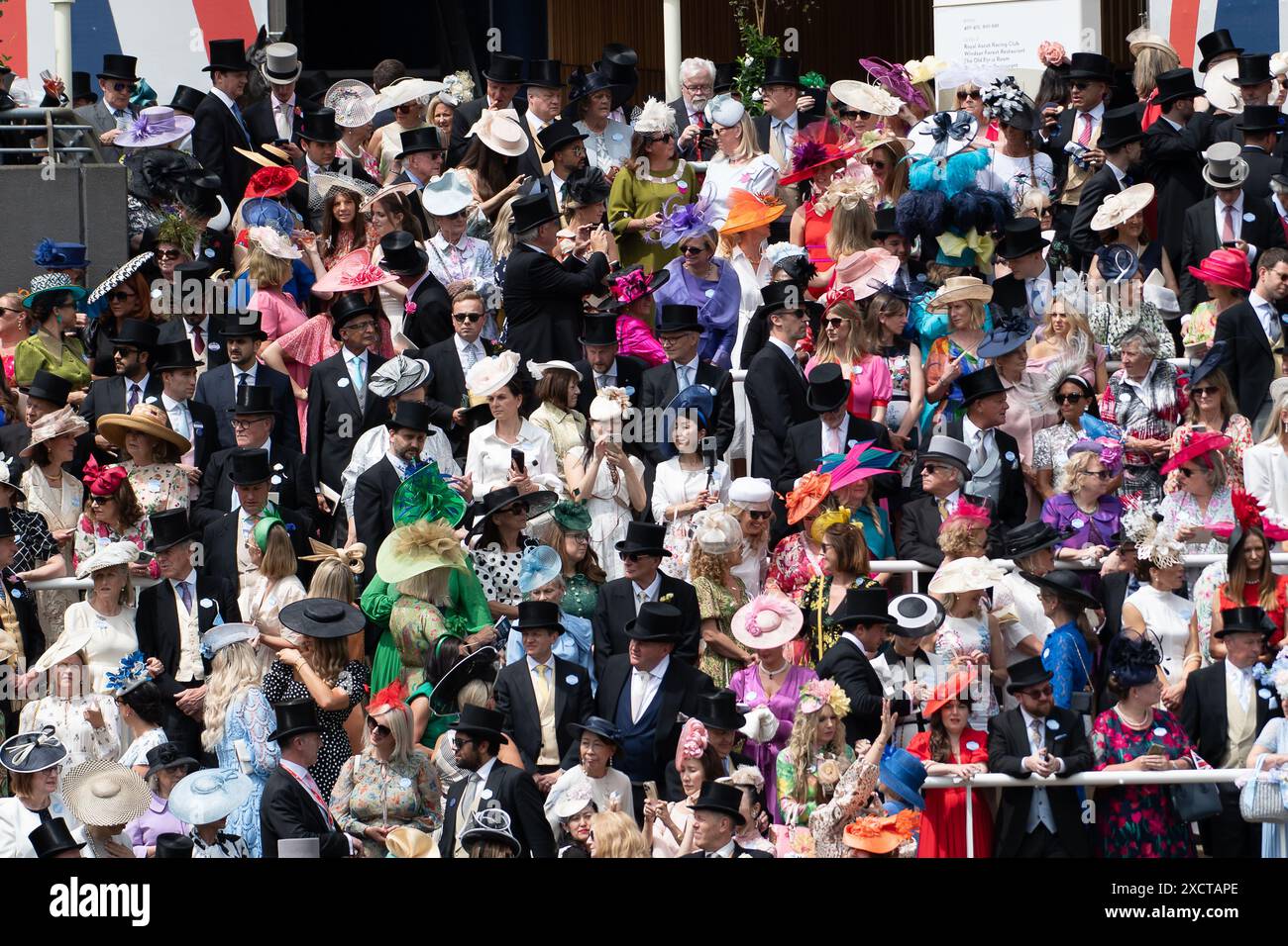 Racegoers in the Parade Ring waiting fo for the Royal Procession on day ...