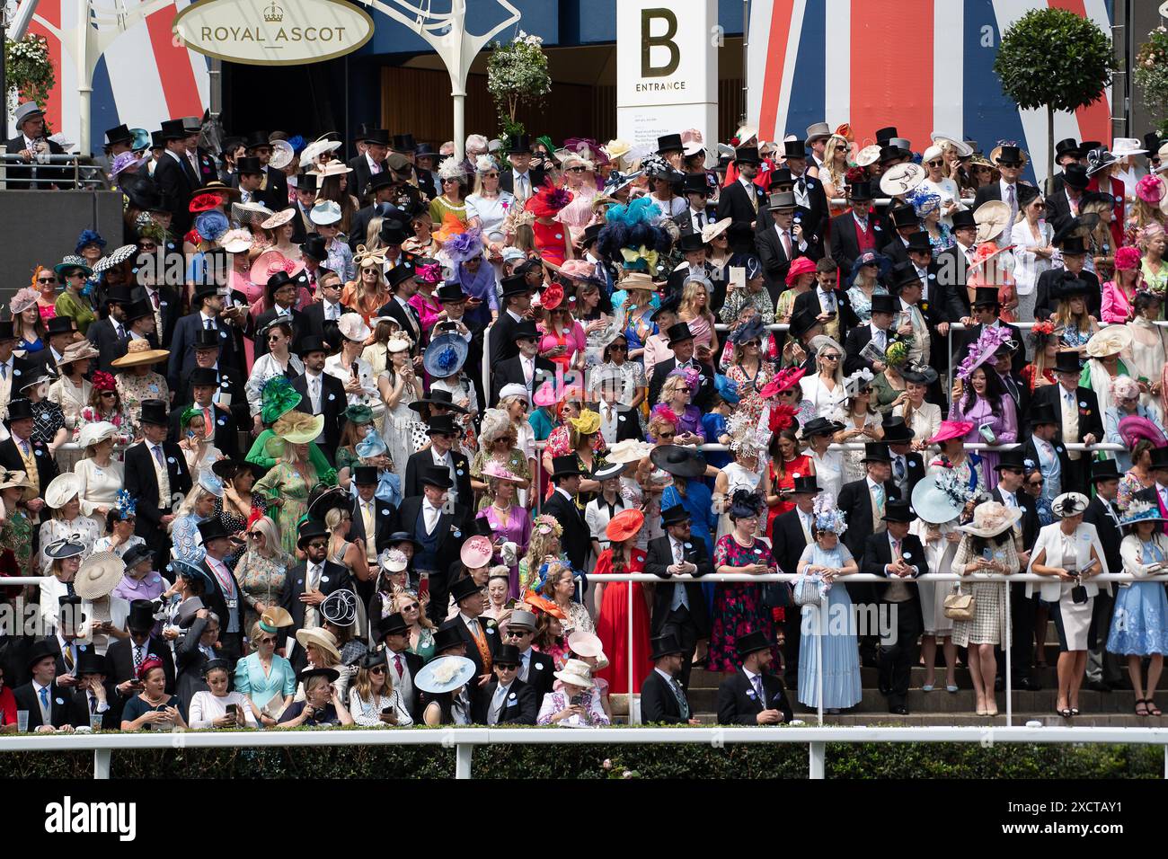 Racegoers in the Parade Ring waiting fo for the Royal Procession on day ...