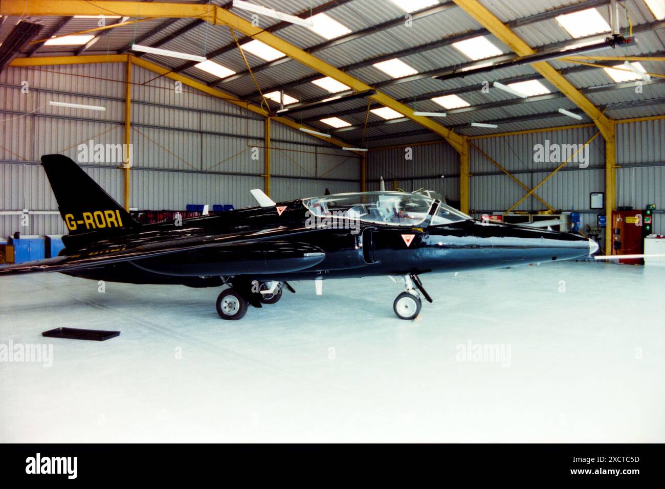 Former RAF jet trainer Folland Gnat T1 G-RORI in a hangar at North Weald, Essex, UK. Ex military ...
