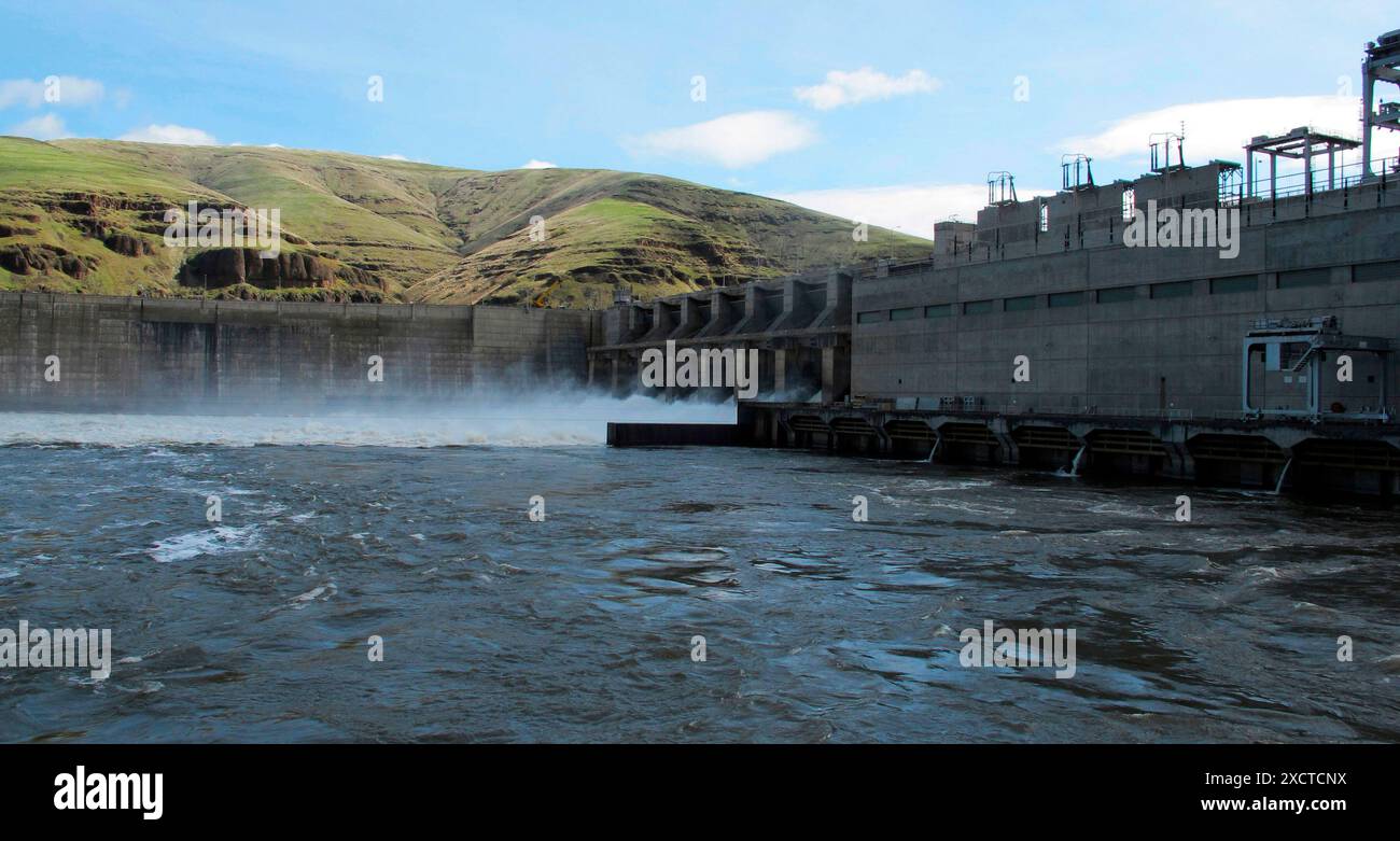 FILE - Water moves through a spillway of the Lower Granite Dam on the ...