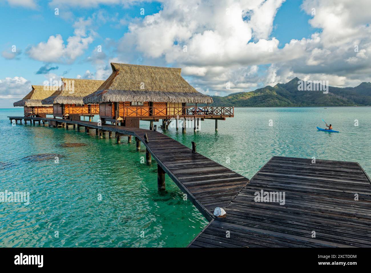 FRENCH POLYNESIA. TAHAA ISLAND. BUNGALOWS ON STILTS AT VAHINE ISLAND ...