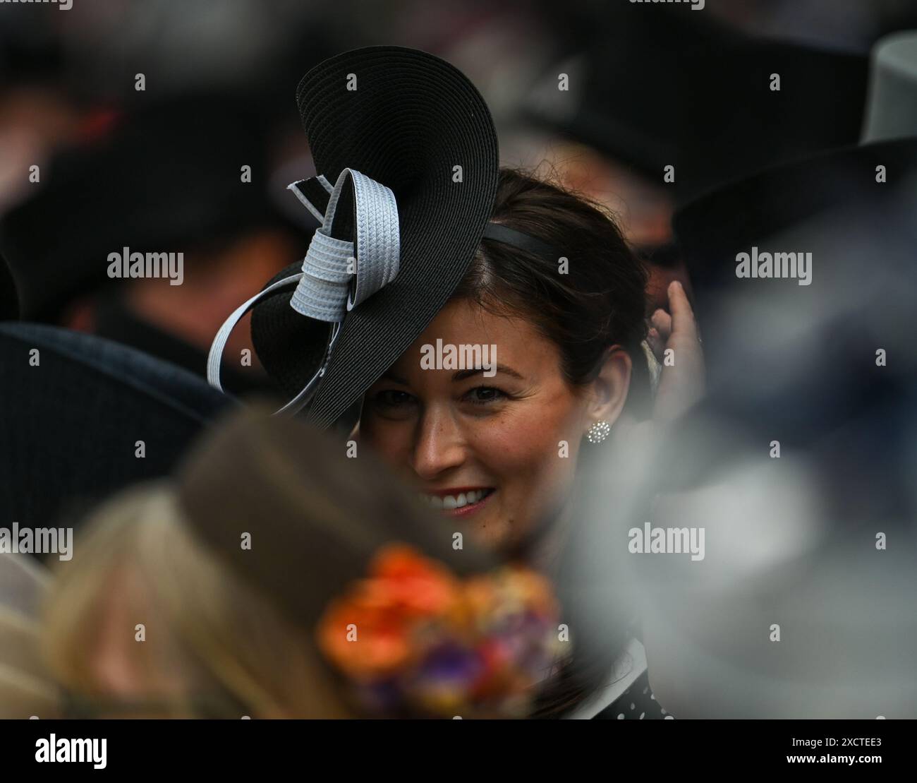 Ascot, UK. 18 June, 2024. A visitor to the Royal Enclosure on day one ...