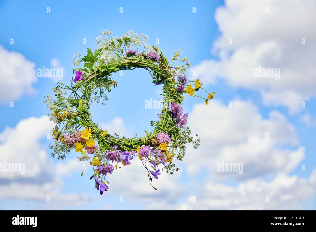 Midsummer background. Floral Wreath in Sky Stock Photo - Alamy