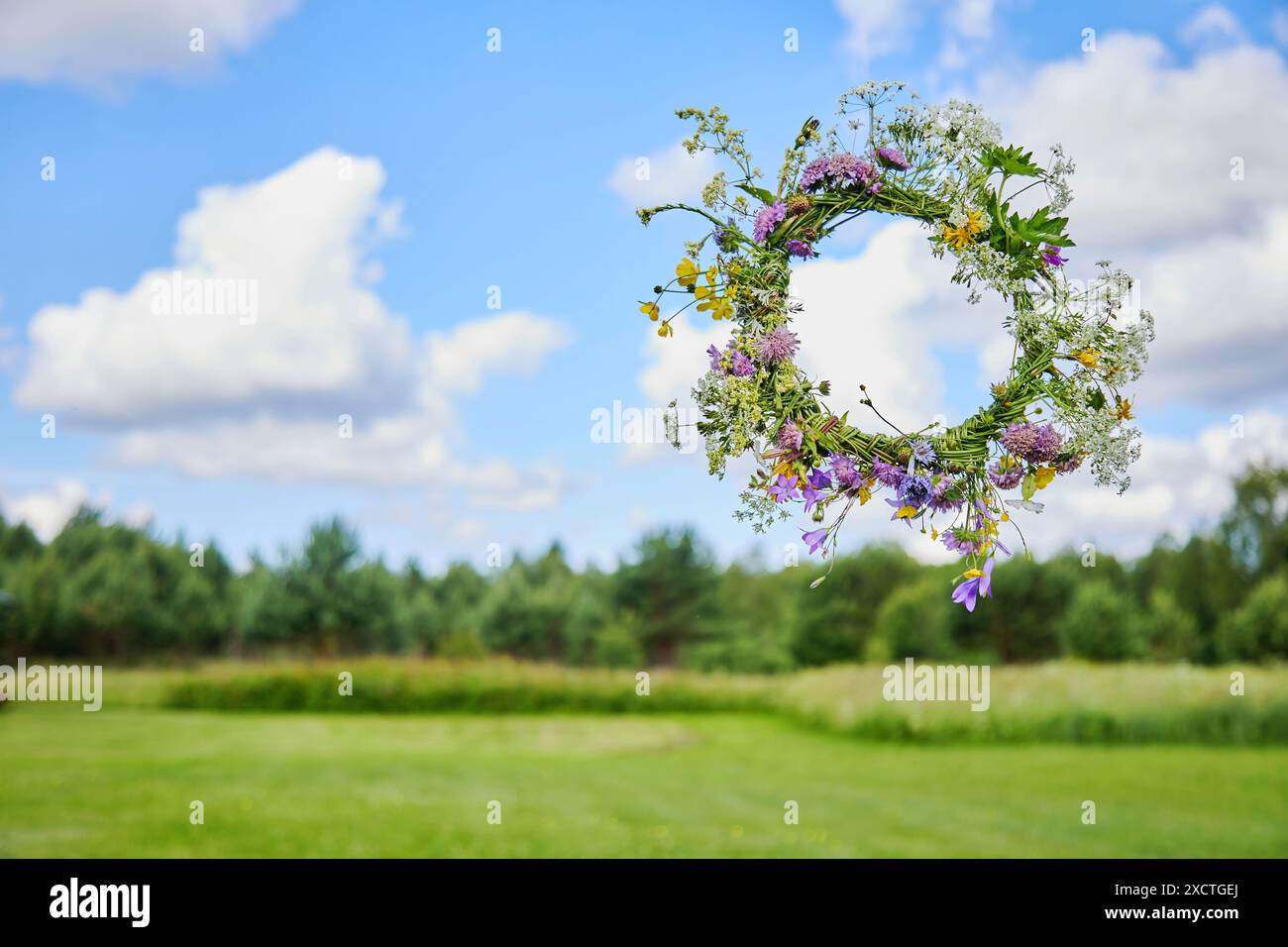 Midsummer background. Floral Wreath in Nature Stock Photo - Alamy