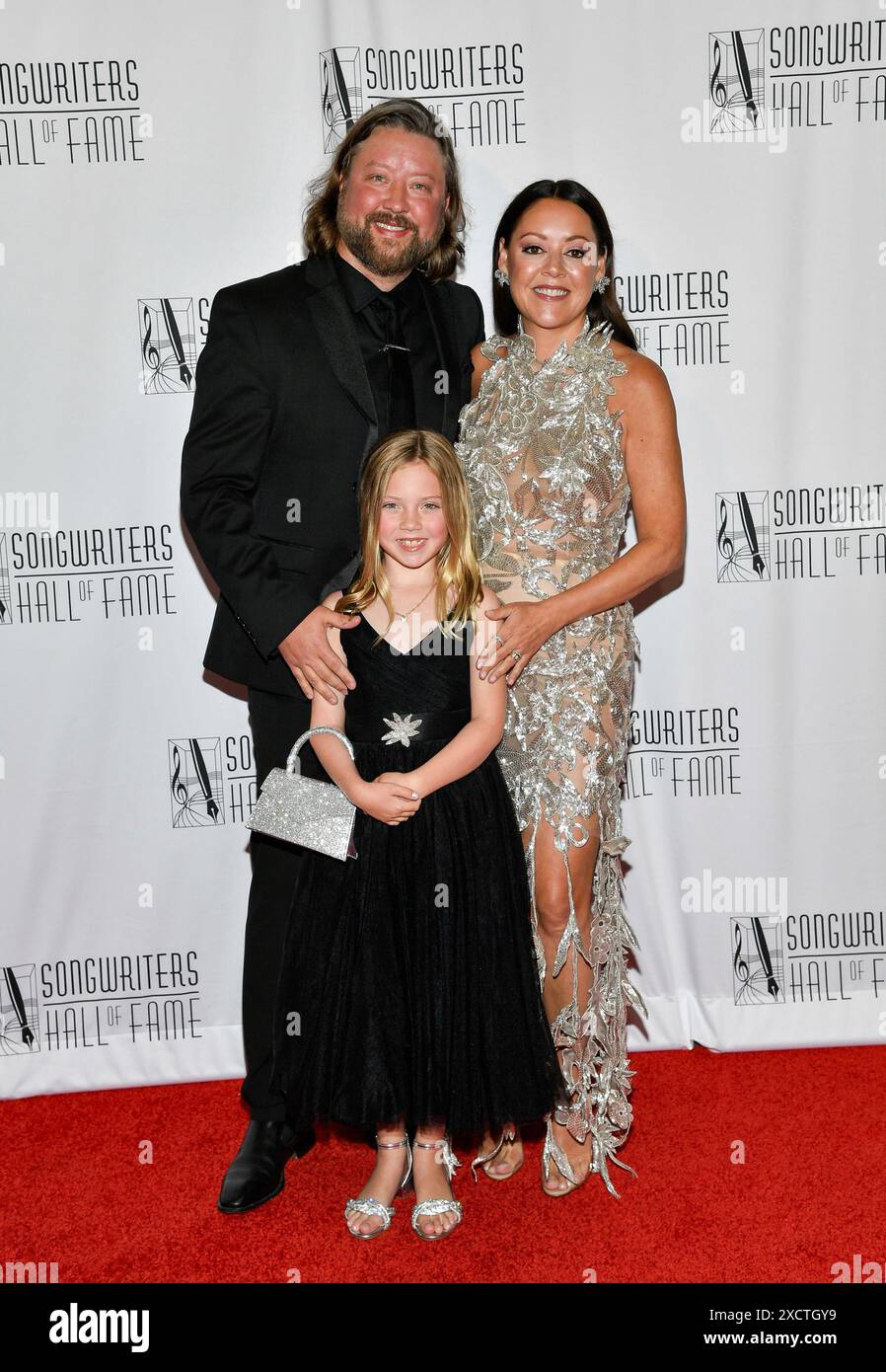 Hillary Lindsey, right, Cary Barlowe and their daughter arrive at the Songwriters Hall of Fame ...