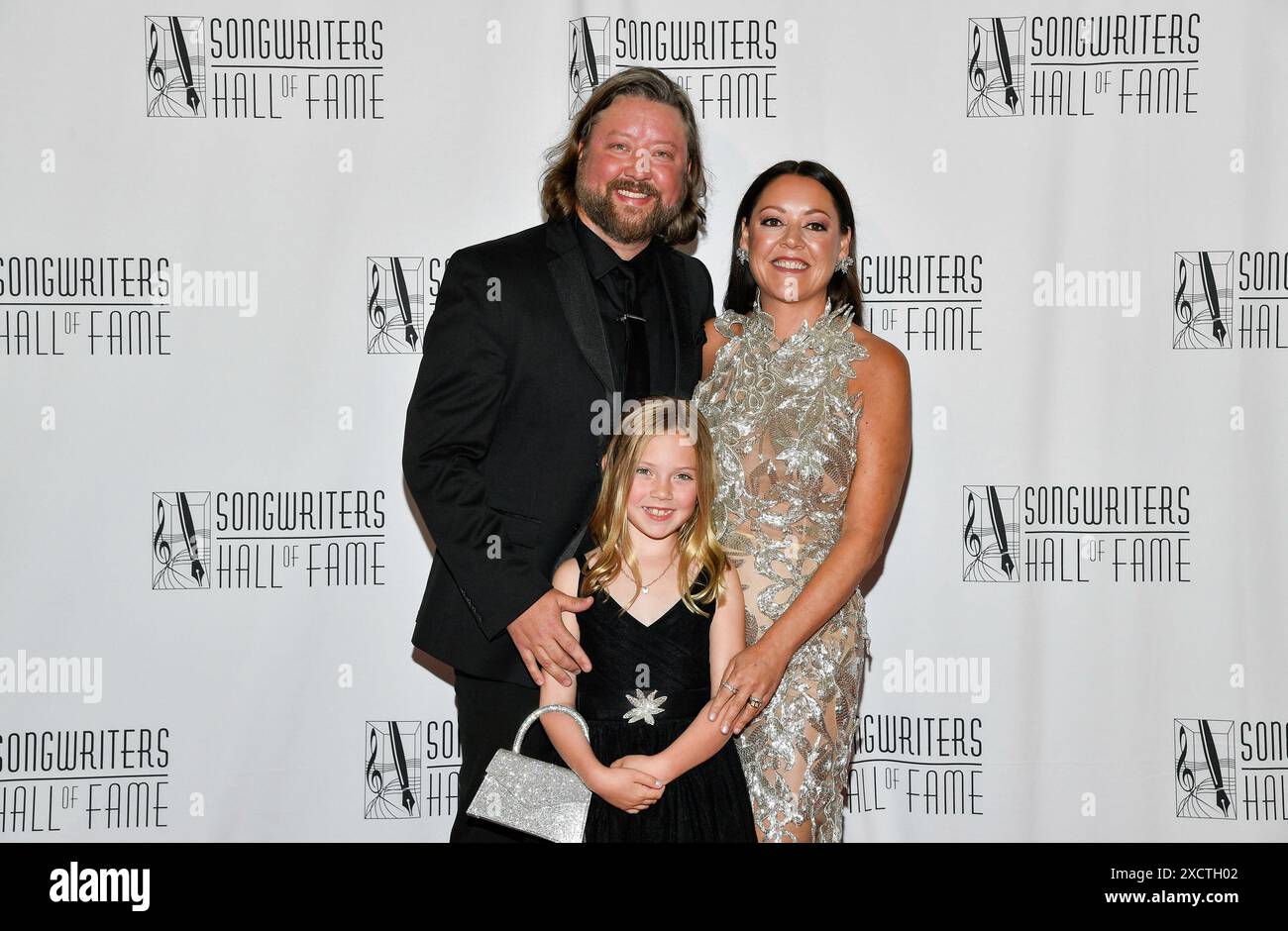 Hillary Lindsey, right, Cary Barlowe and their daughter arrive at the Songwriters Hall of Fame ...