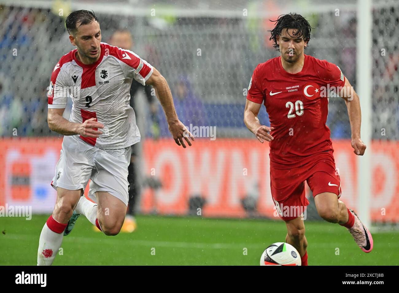 Dortmund, Germany. 18th June, 2024. Otar Kakabadze (2) of Georgia and Ferdi Kadioglu (20) of ...