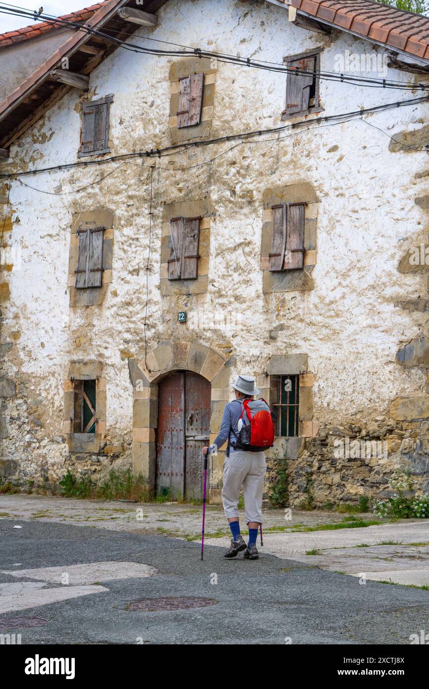 Pilgrim in the Spanish village of Viskarret while walking the Camino de ...