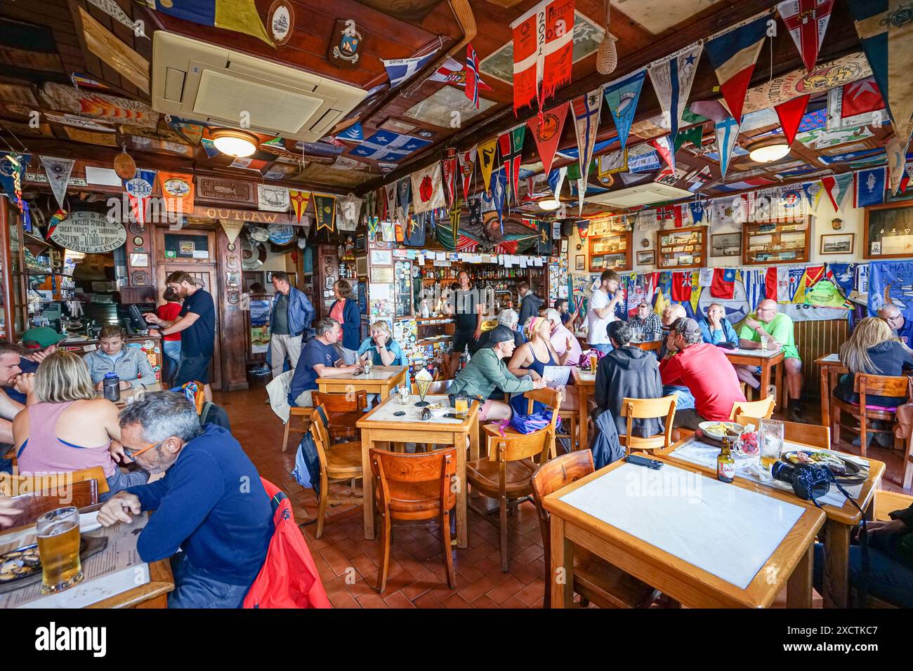 Group of people inside the famous Peters bar in Faial-Açores-Portugal ...