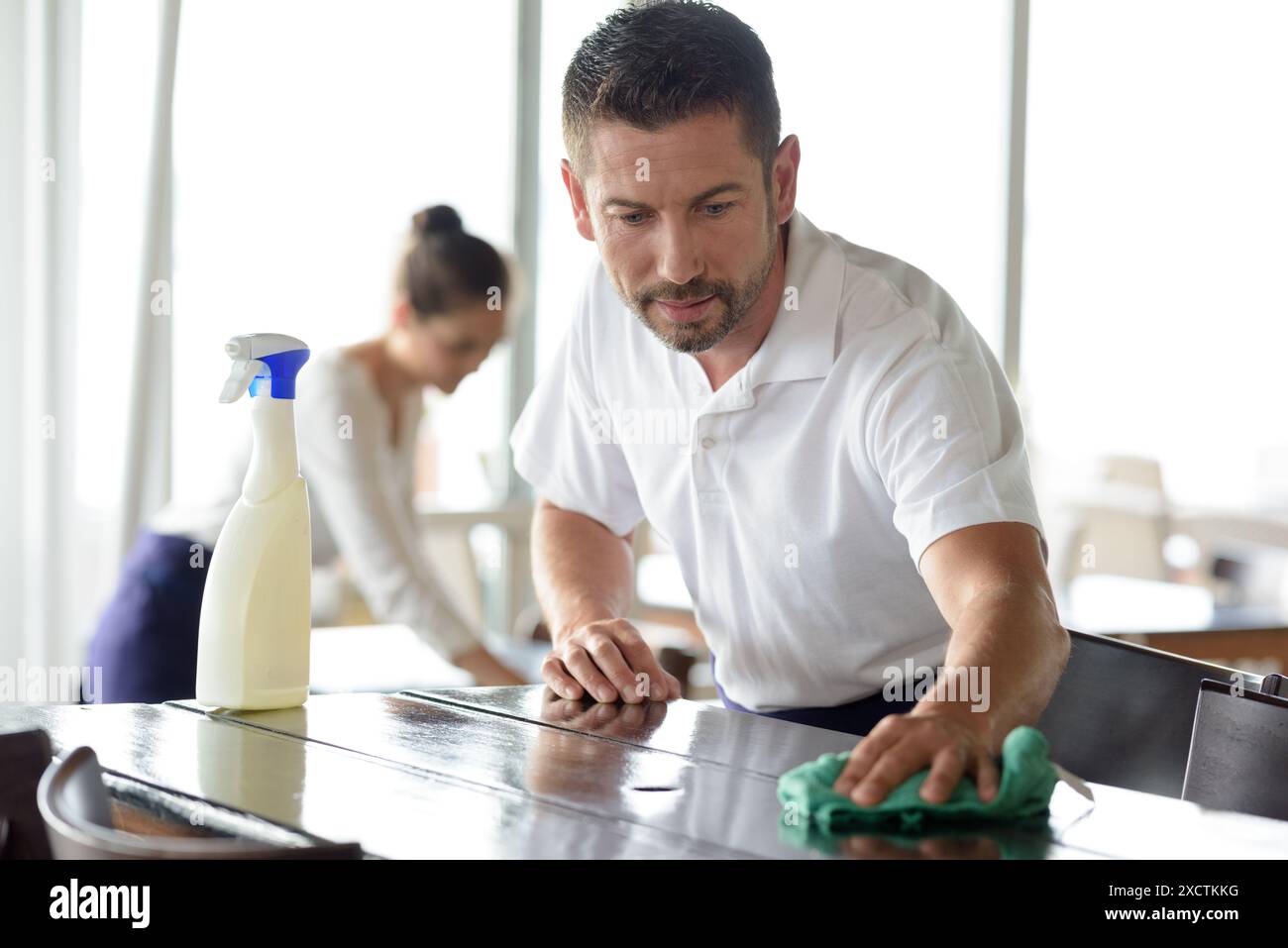 portrait of a waiter cleaning bar Stock Photo - Alamy