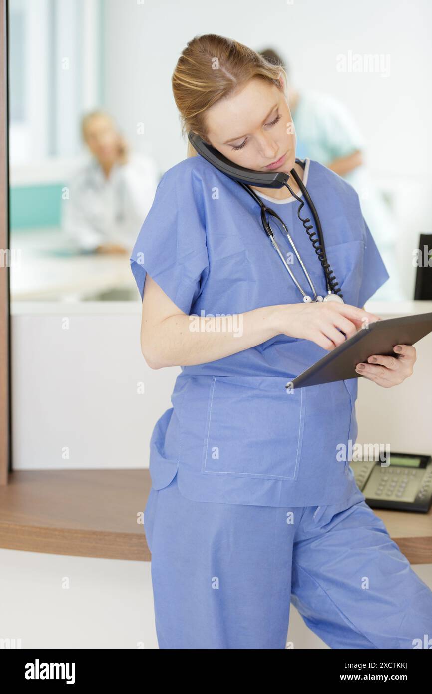 female emergency operator answers calls Stock Photo - Alamy