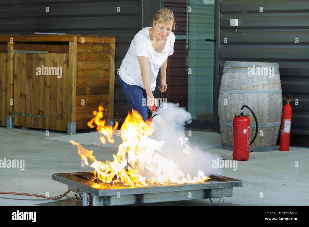 Using fire extinguisher hi-res stock photography and images - Alamy
