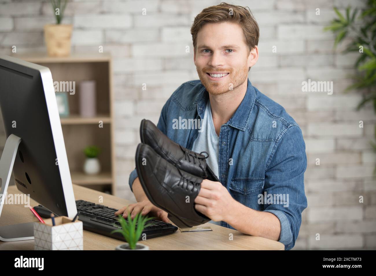 Young woman selling shoes hi-res stock photography and images - Alamy