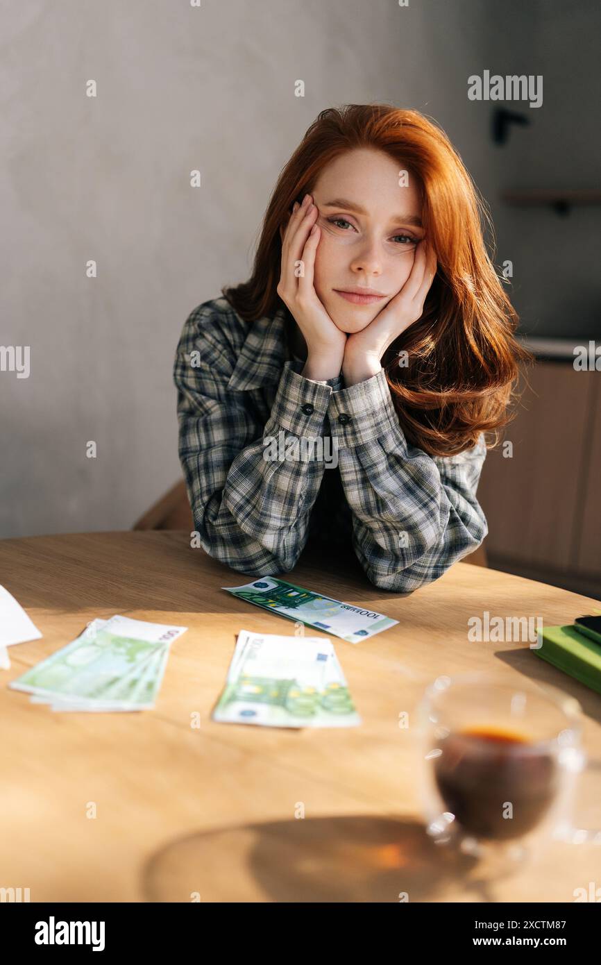 Vertical portrait of despair woman counting dollar bills and feeling ...