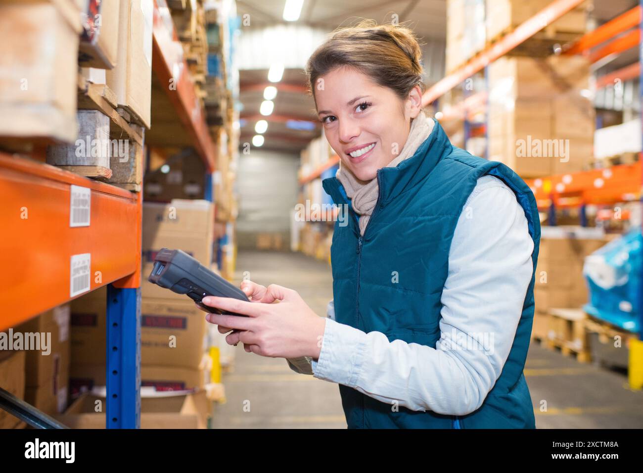 woman holds scanner and scans barcode with laser Stock Photo - Alamy