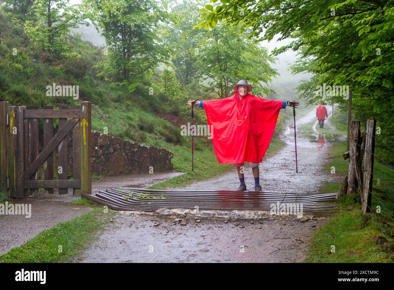 Pilgrim crossing the French Spanish border while walking the Camino de ...