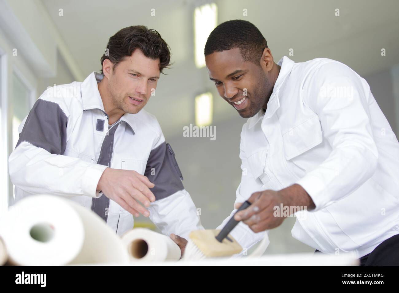 observing the brushing technique of the apprentice Stock Photo - Alamy