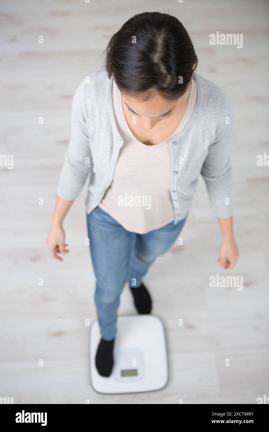 Feet scales looking down hi-res stock photography and images - Alamy