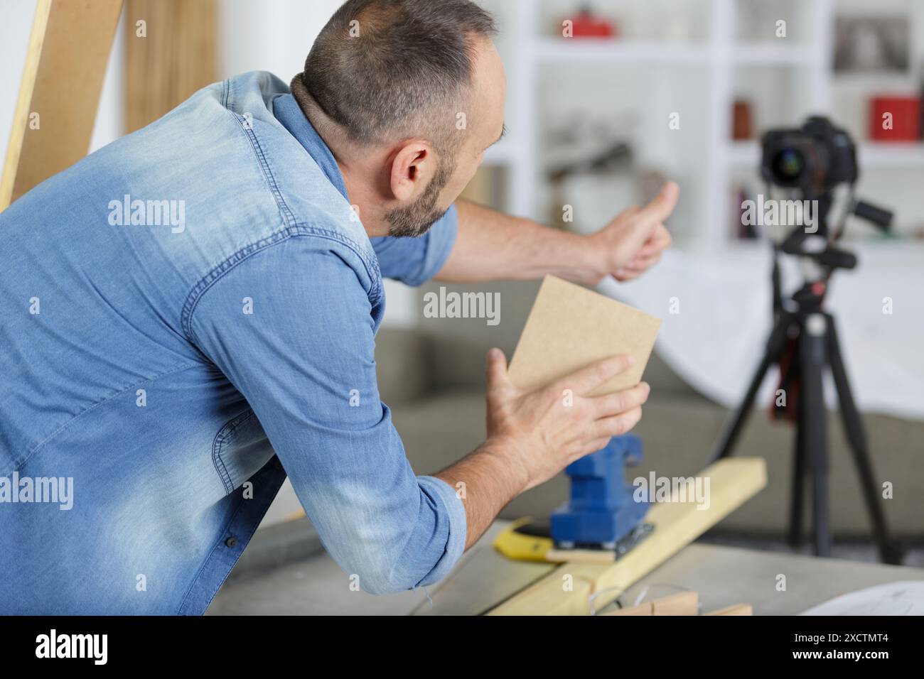 vlogger recording computer repair on camera for vlog blog Stock Photo ...