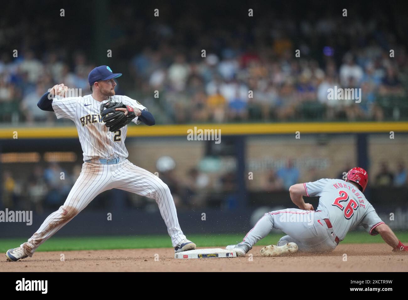 Milwaukee Brewers second baseman Brice Turang (2) forces out Cincinnati ...