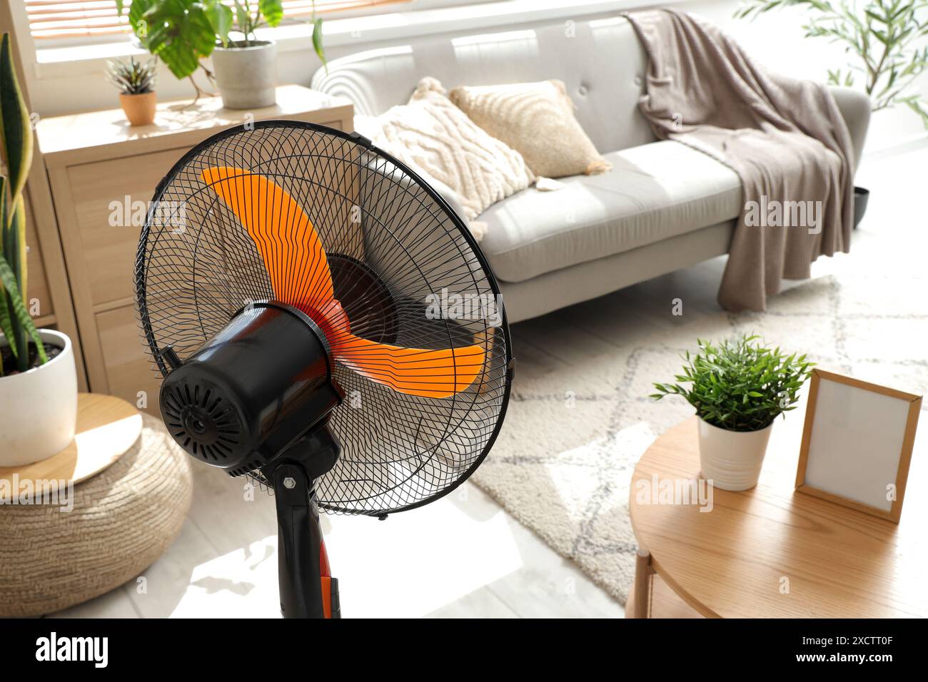 Electric fan in modern living room Stock Photo - Alamy