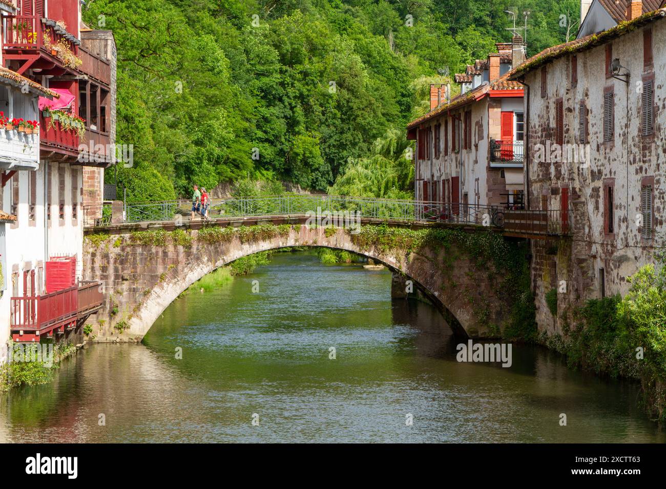 The river Nive flowing through the town of Saint-Jean-Pied-de-Port the ...