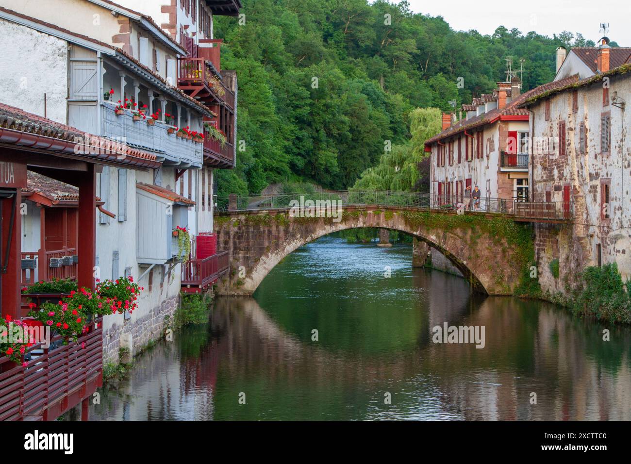 The river Nive flowing through the town of Saint-Jean-Pied-de-Port the ...