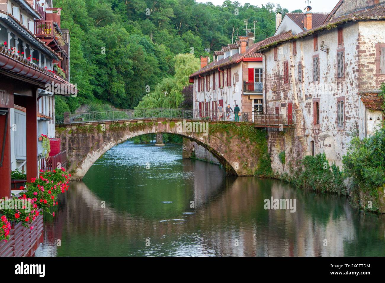 The river Nive flowing through the town of Saint-Jean-Pied-de-Port the ...