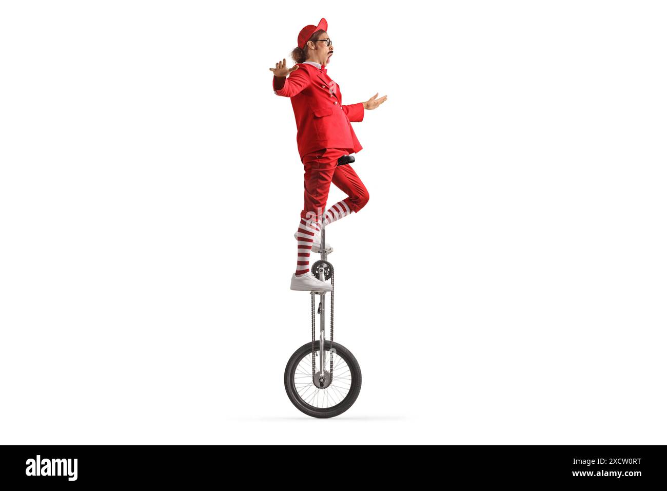 Funny entertainer riding a monocycle isolated on white background Stock ...