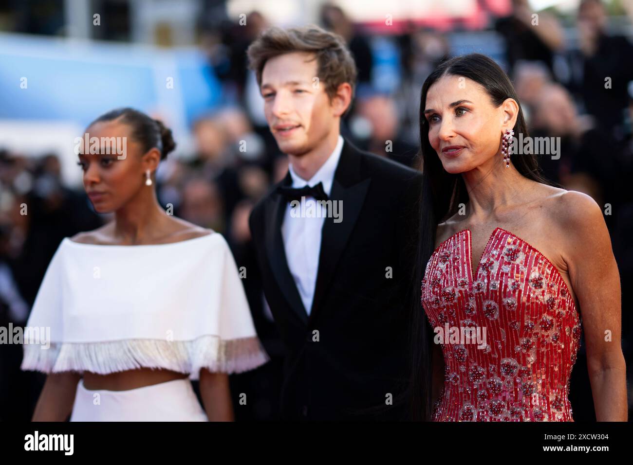 Sophie Wilde, from left, Mike Faist, and Demi Moore pose for ...