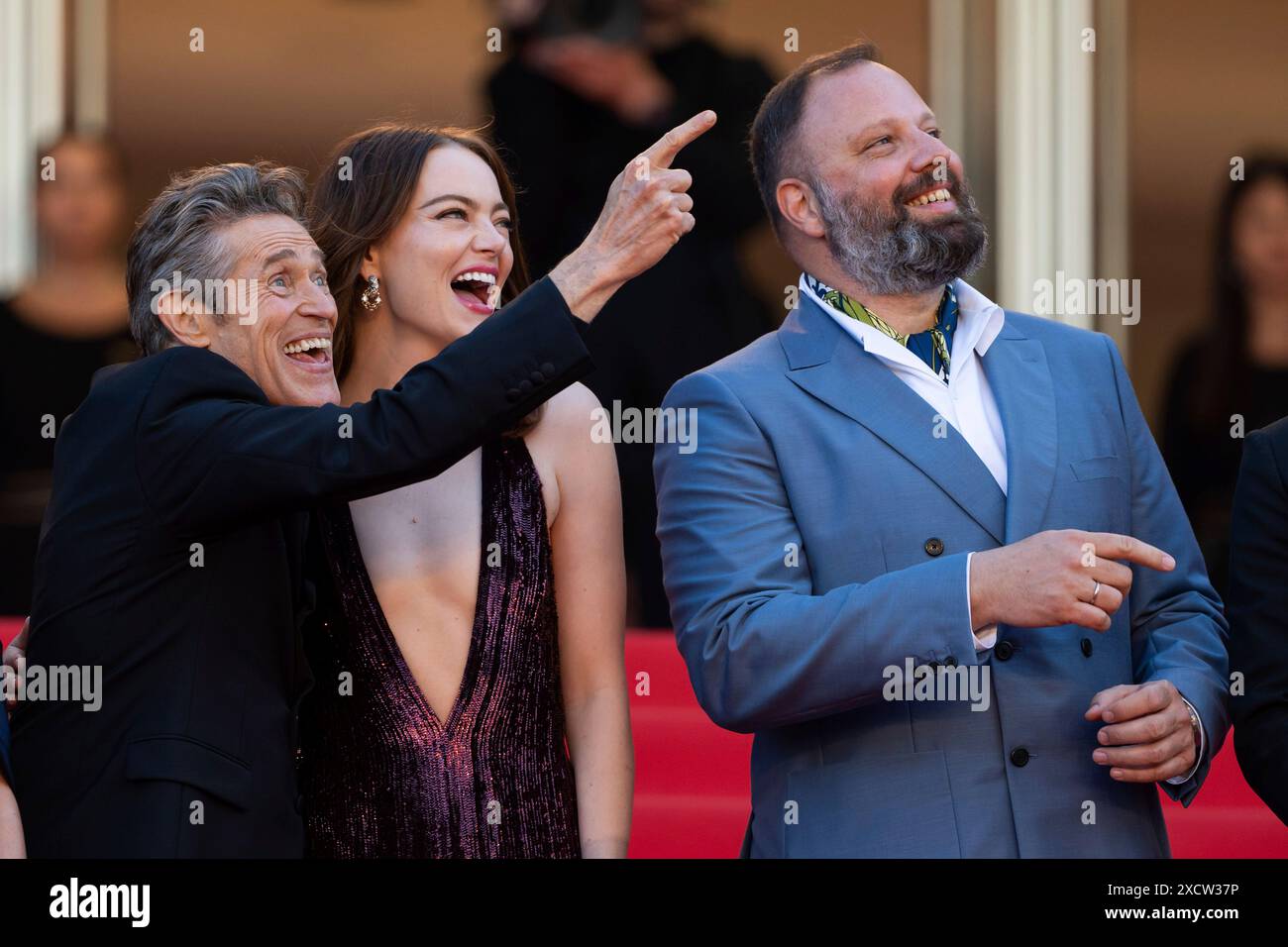 Willem Dafoe, from left, Emma Stone, and director Yorgos Lanthimos pose for photographers upon ...