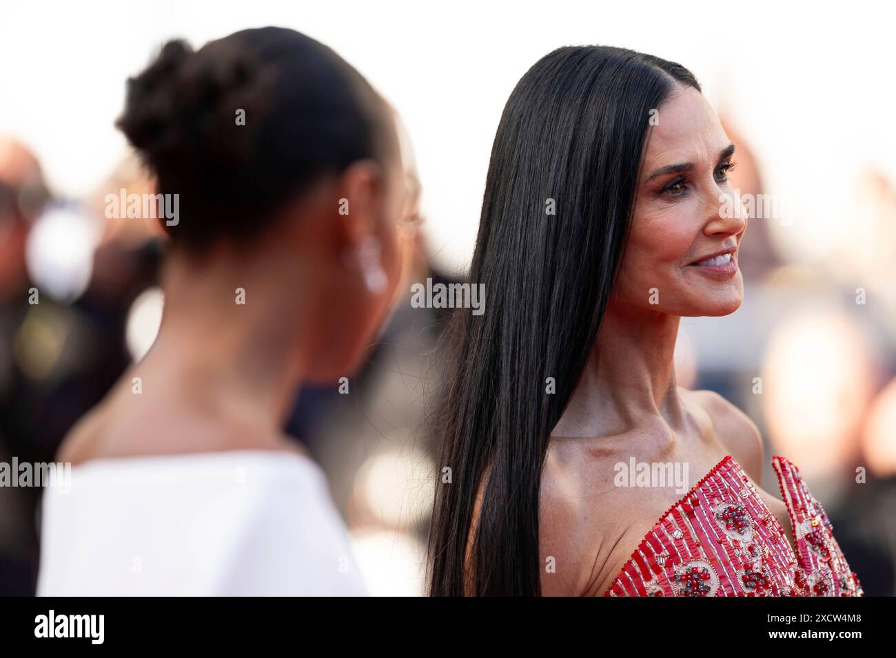 Sophie Wilde, left, and Demi Moore pose for photographers upon arrival ...