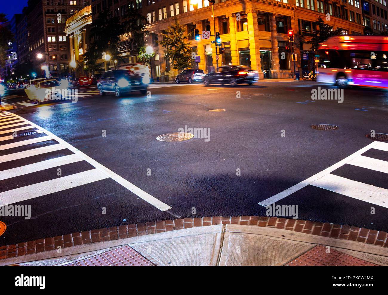 Night view of a downtown intersection Stock Photo - Alamy
