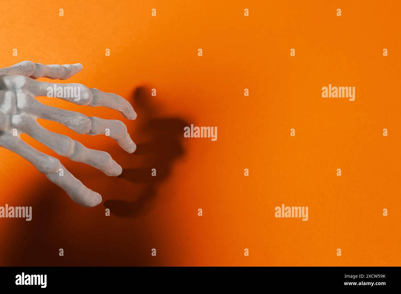 Skeleton hand with scary shadow, Halloween background with copy space ...
