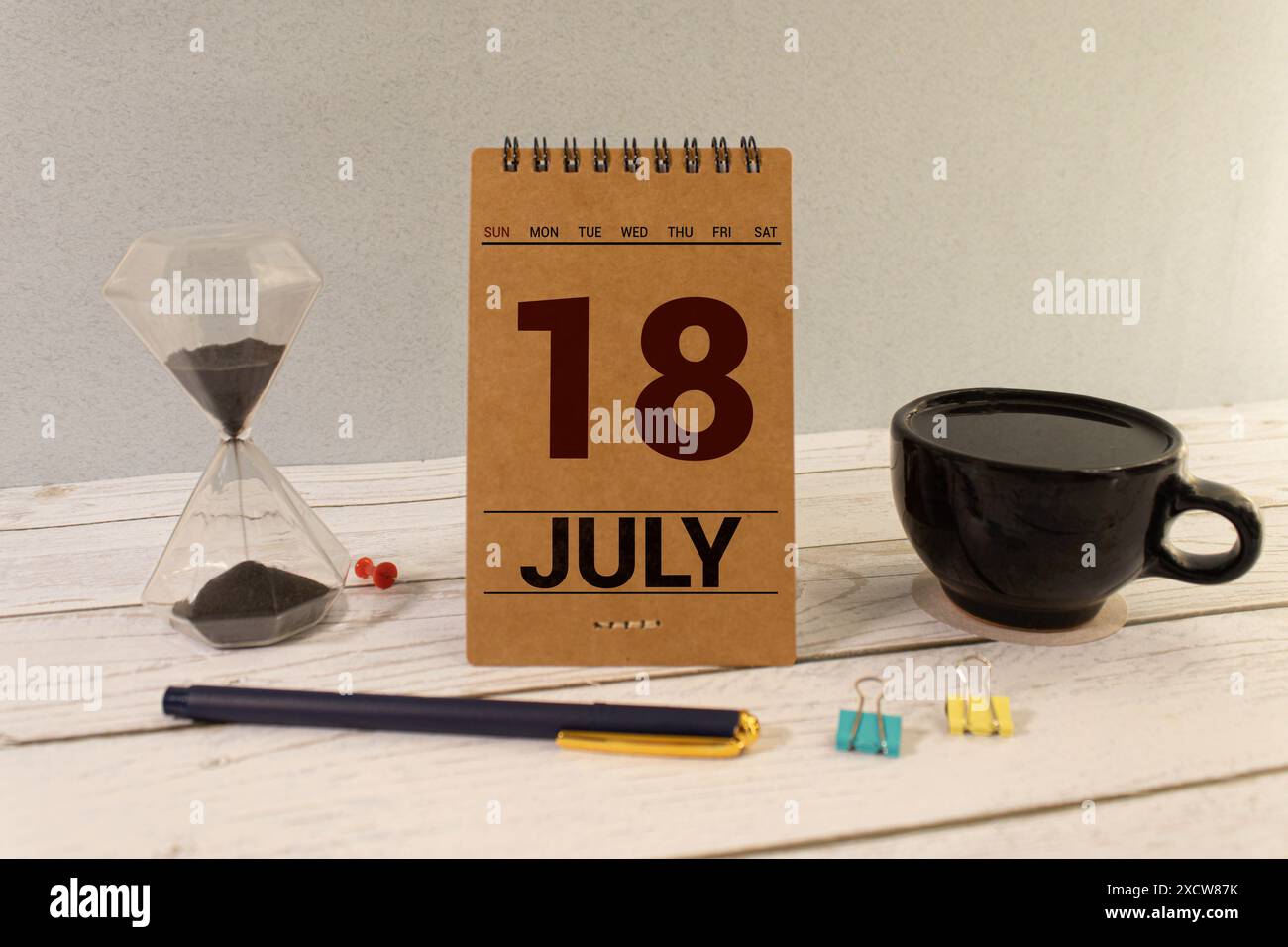 White calendar cubes with date july 18 on yellow background. Creative ...