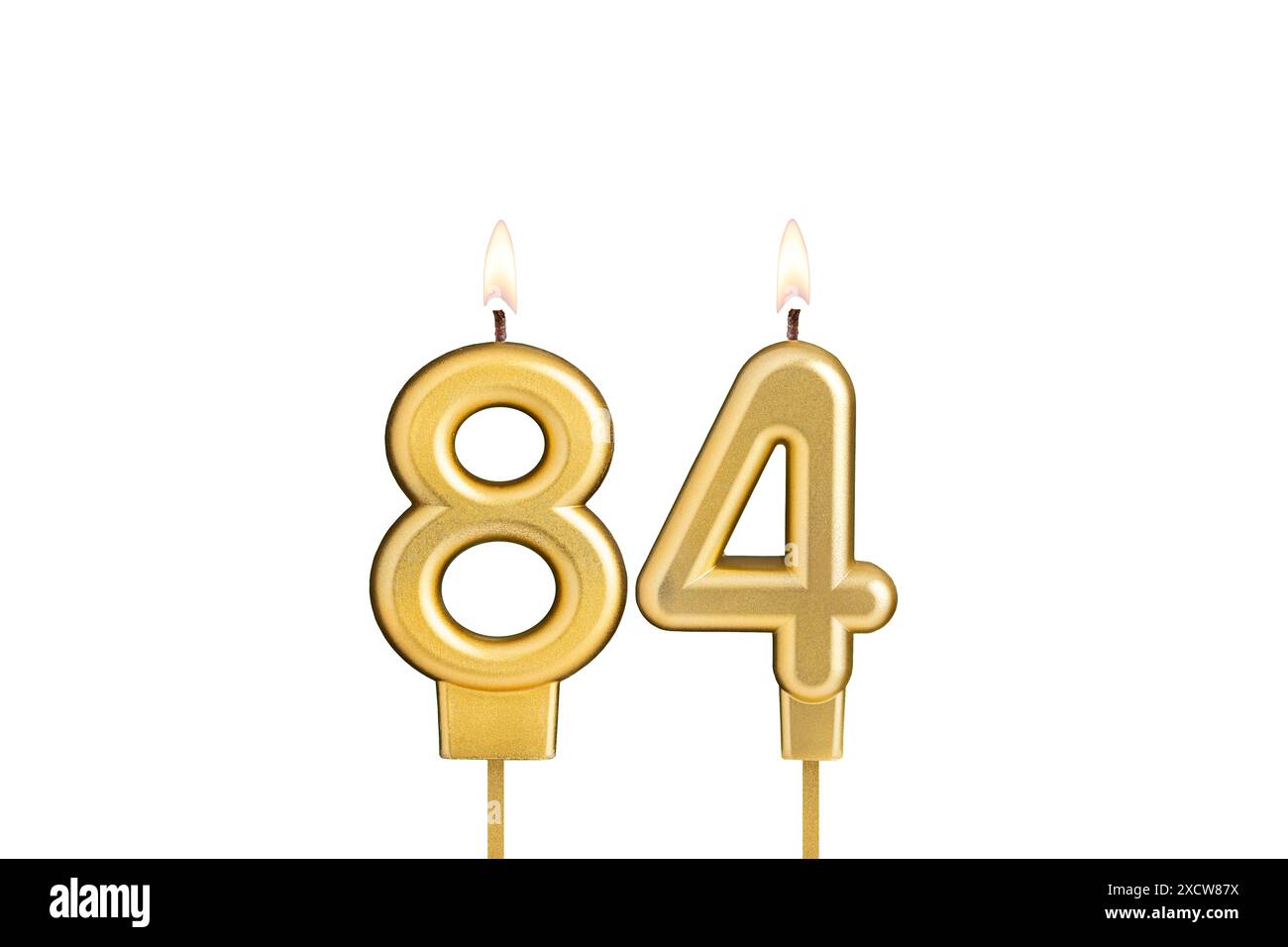 Golden number 84 birthday candle on white background Stock Photo - Alamy