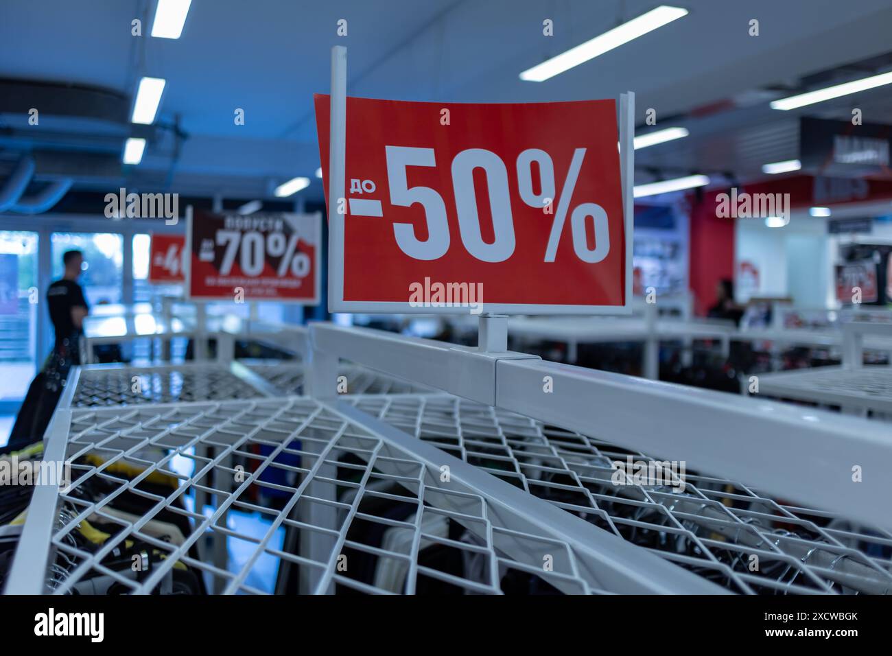 Seasonal sale 50% off, holiday discounts in shopping mall Stock Photo ...